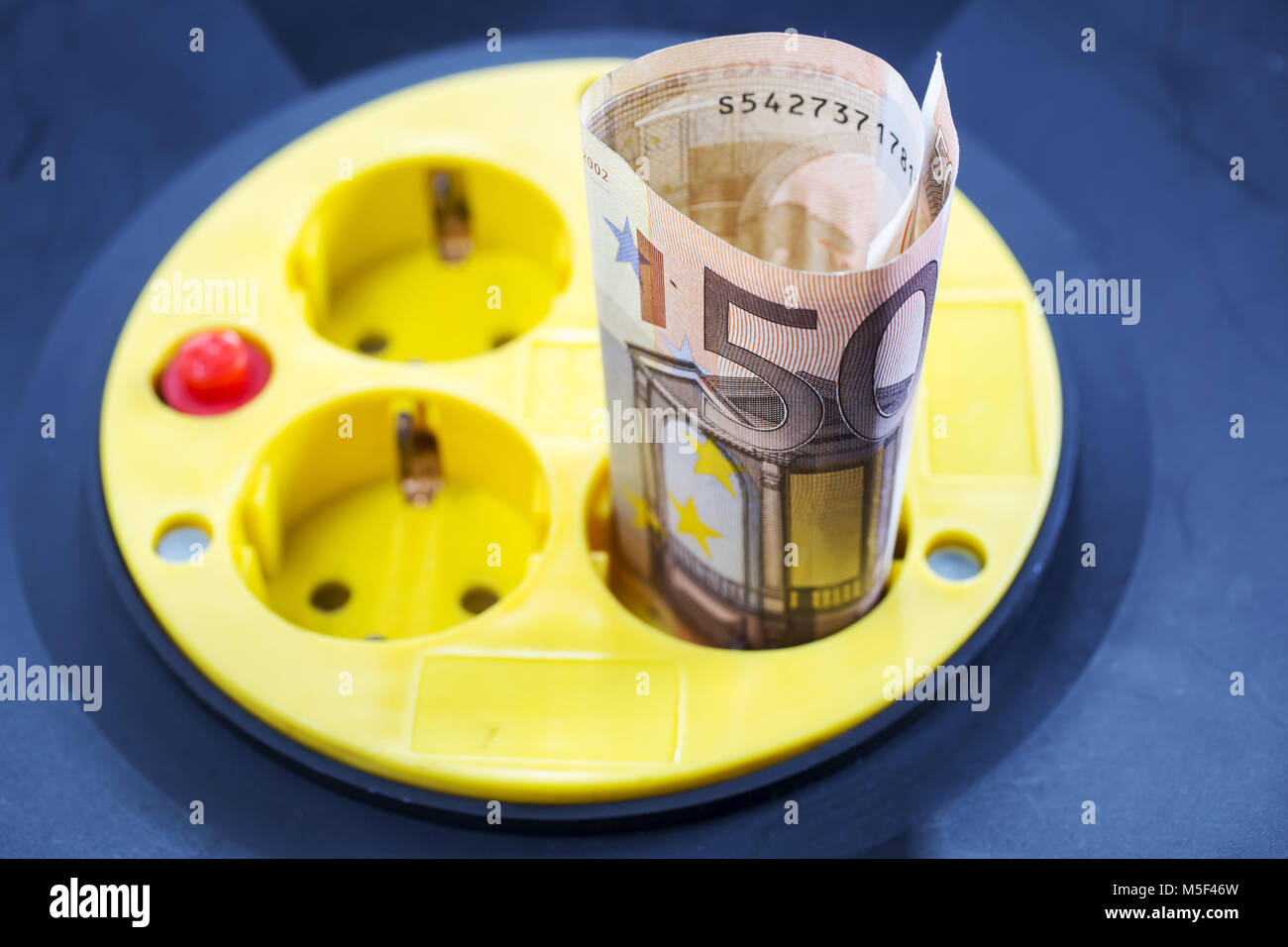 Connection plug with Euro money as symbol for expensive electricity ...