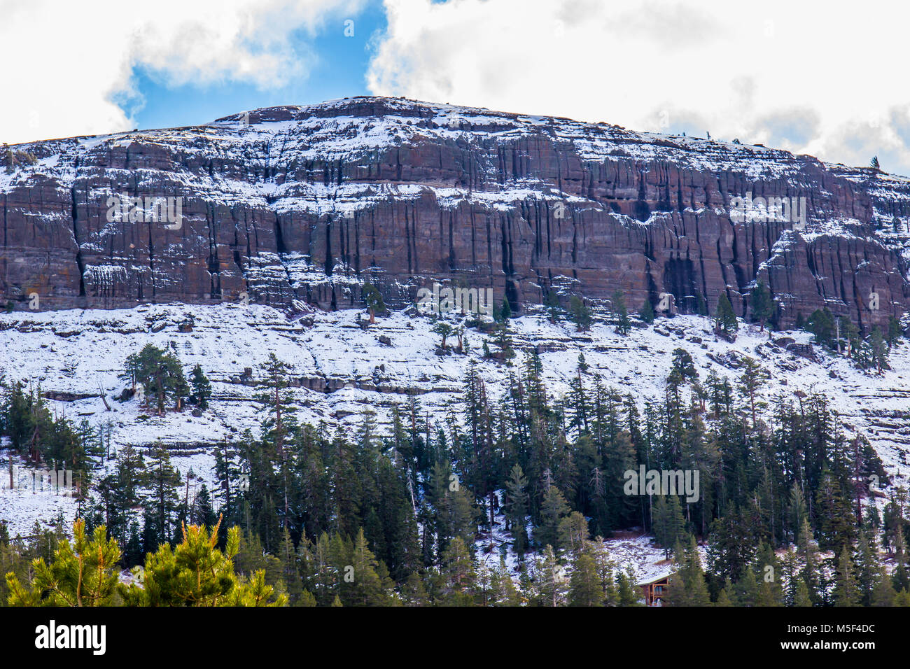 Cliffs On Side Of Snow Covered Mountain Stock Photo - Alamy