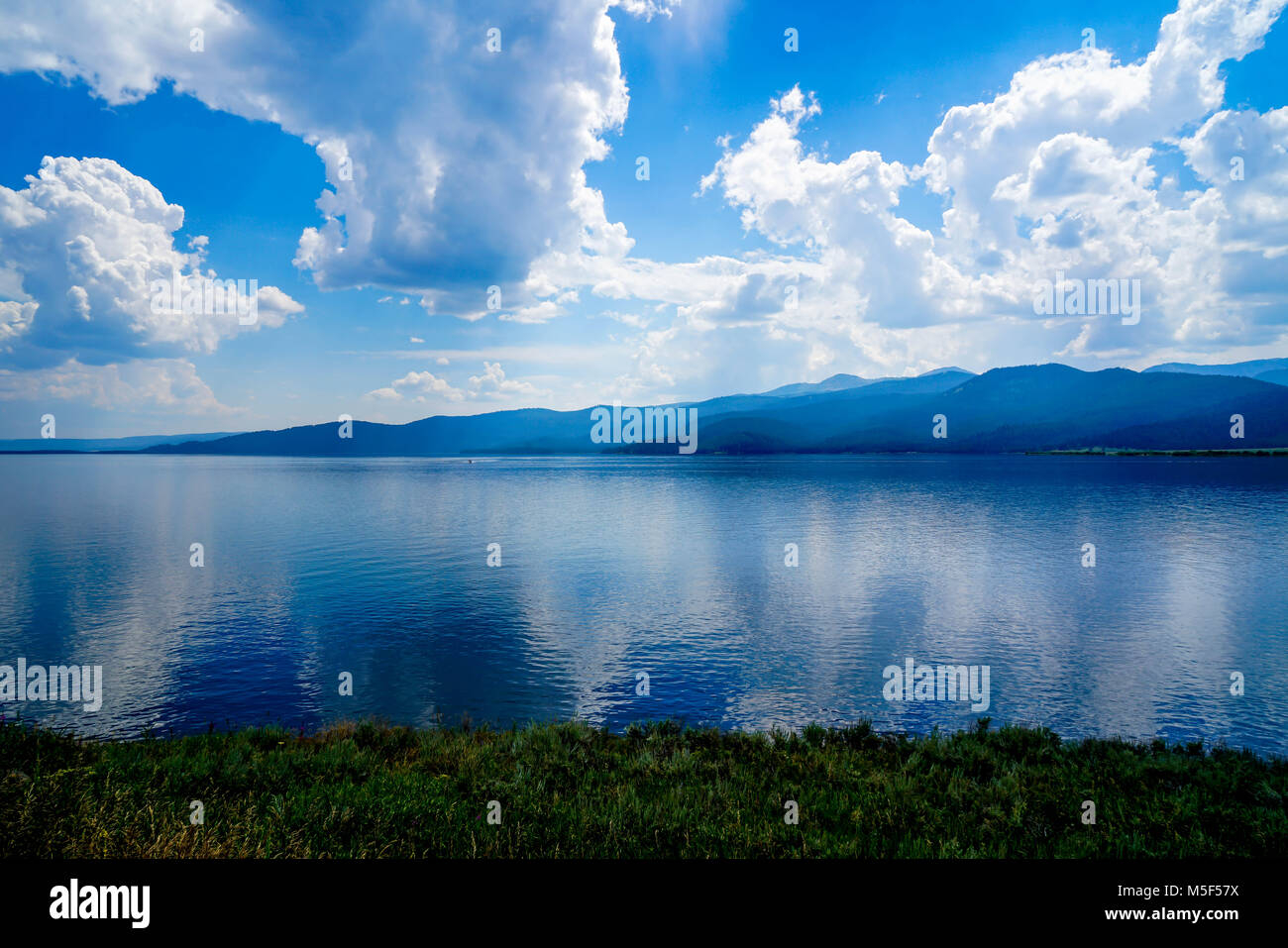 The stunning Jackson Lake in Yellowstone National Park with boaters and ...