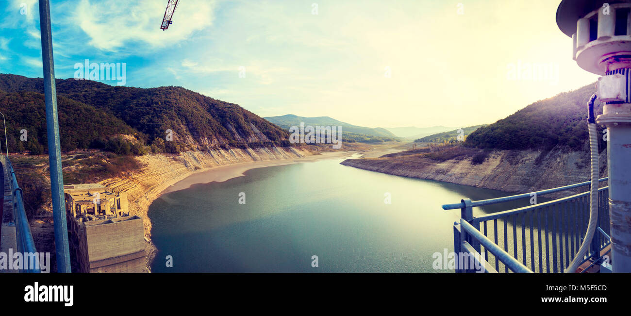 panoramic aerial view of the reservoir of a dam in a valley between the ...