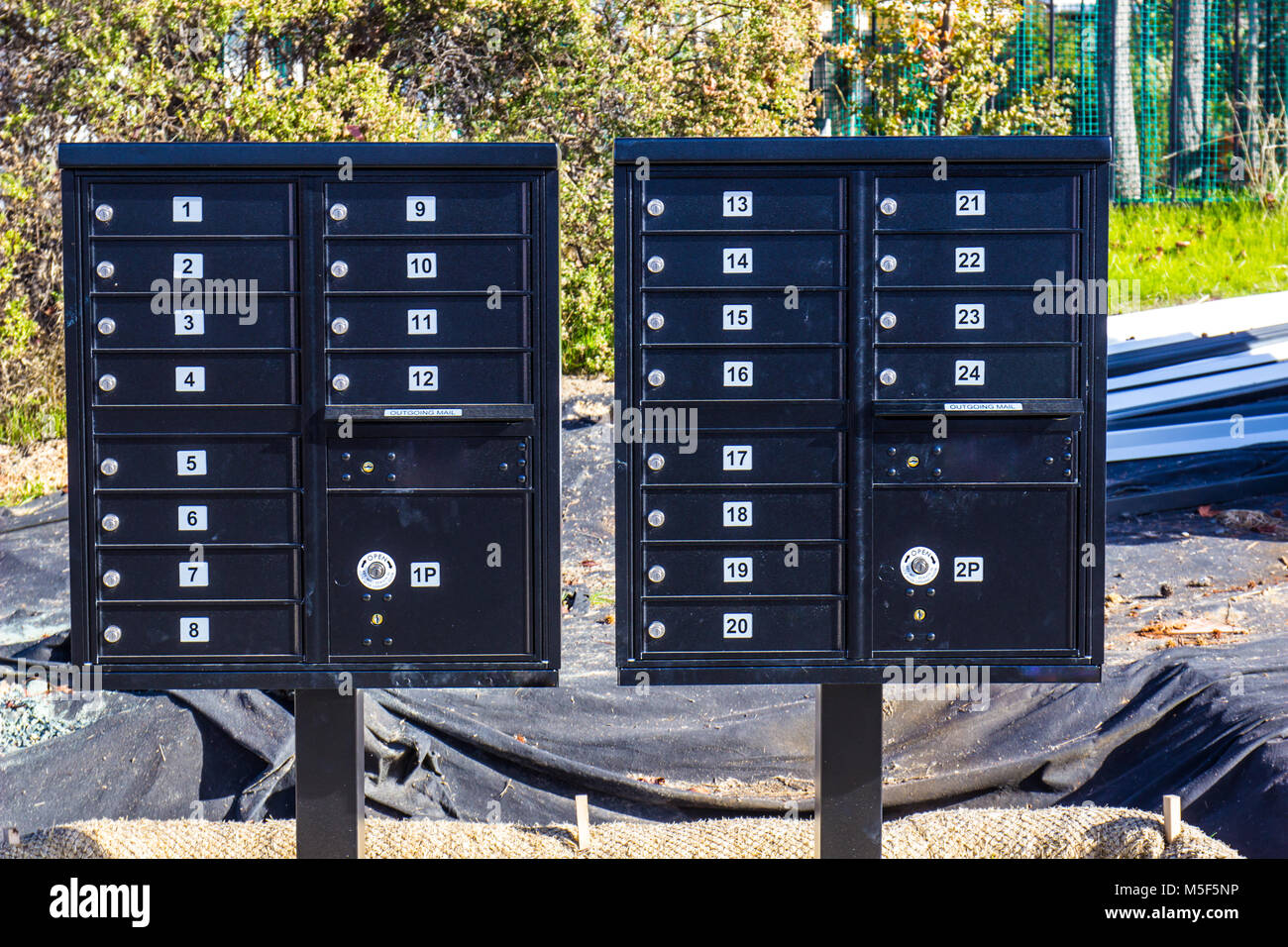 Row Of Stacked Mailboxes For New Home Project Stock Photo - Alamy
