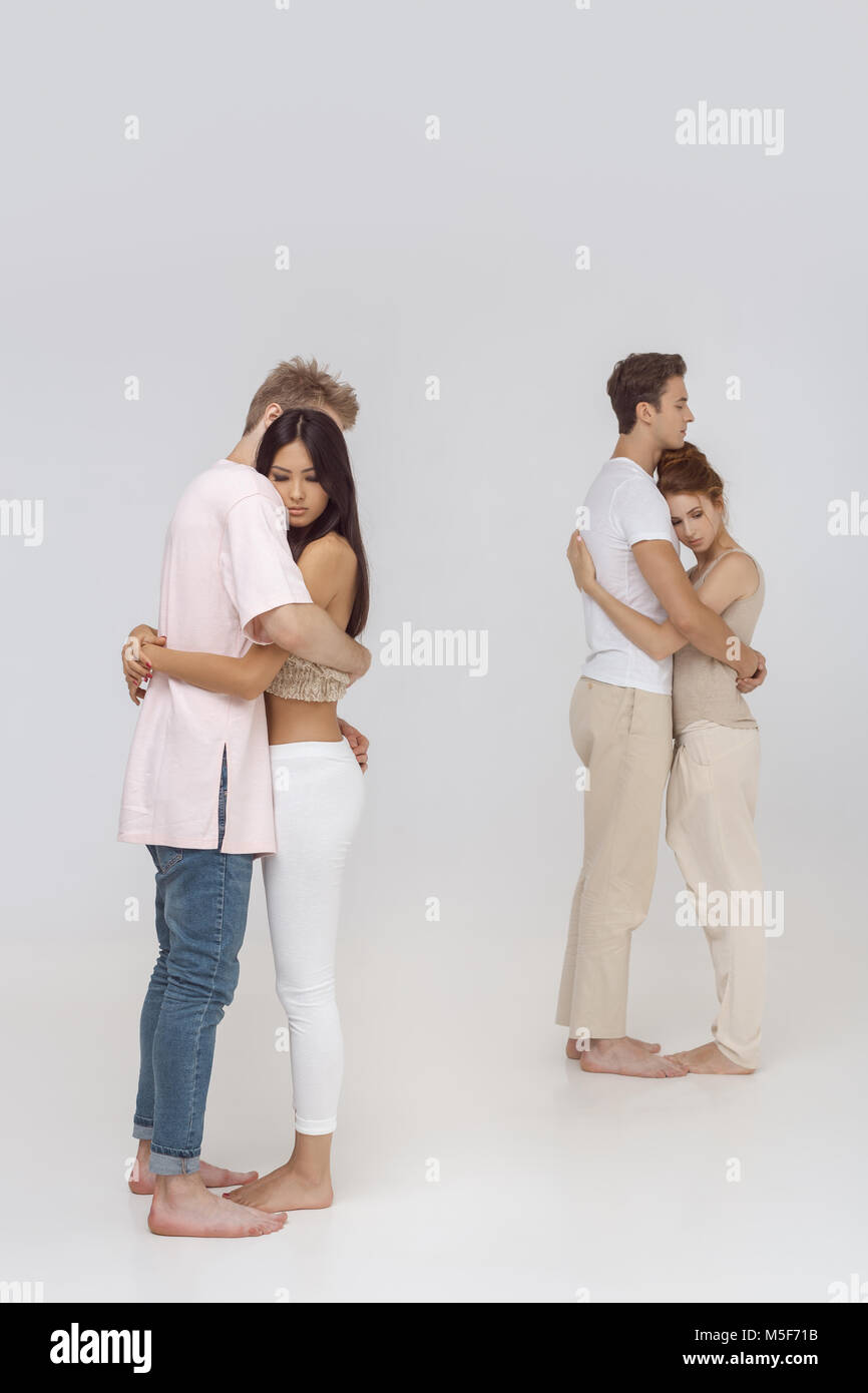 Two romantic couples in love indoors against white Stock Photo - Alamy