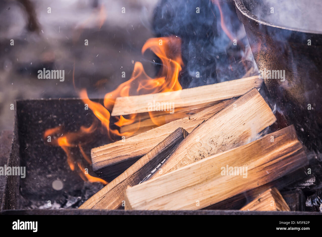 wood burning in the grill, fire for cooking on the fire Stock Photo - Alamy