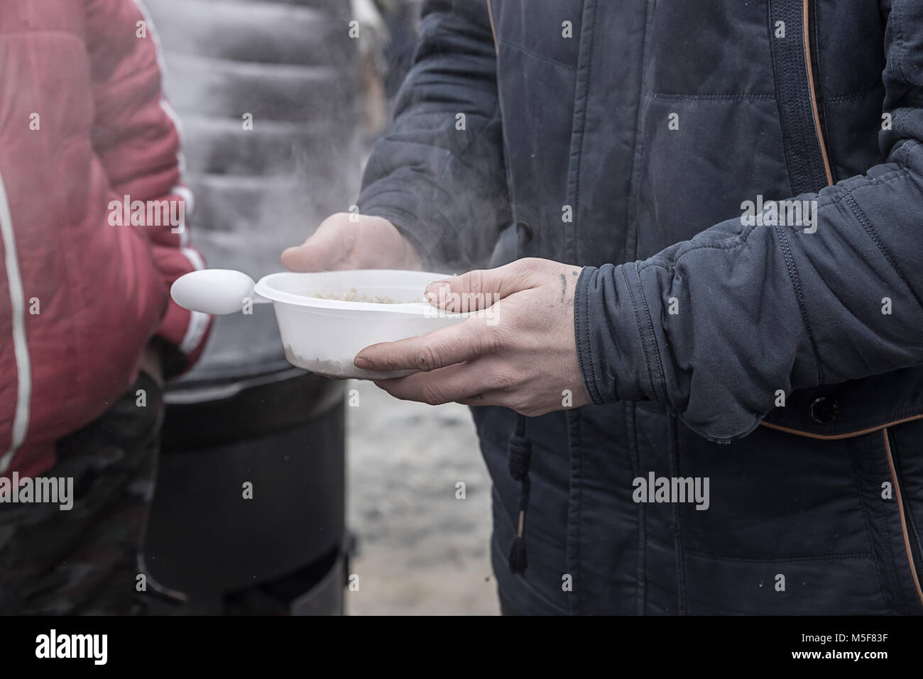 Homeless people gathering food hi-res stock photography and images - Alamy