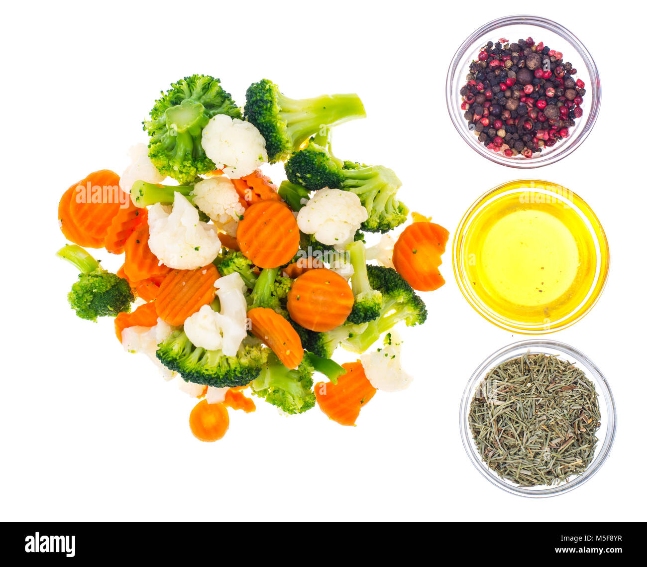 Mix of frozen summer vegetables in heap isolated on white background ...