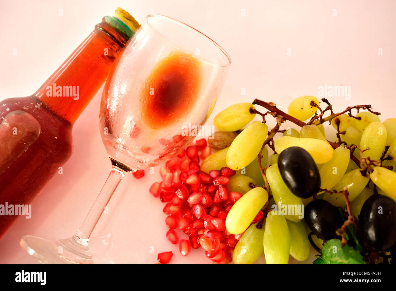 Wine and grapes isolated on white background Stock Photo - Alamy