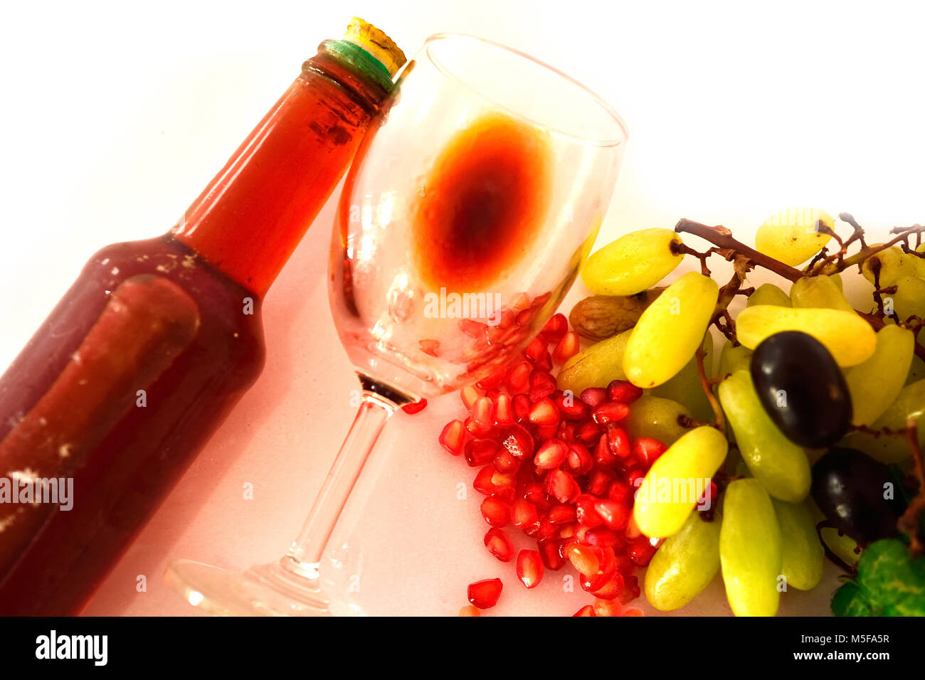 Wine and grapes isolated on white background Stock Photo - Alamy