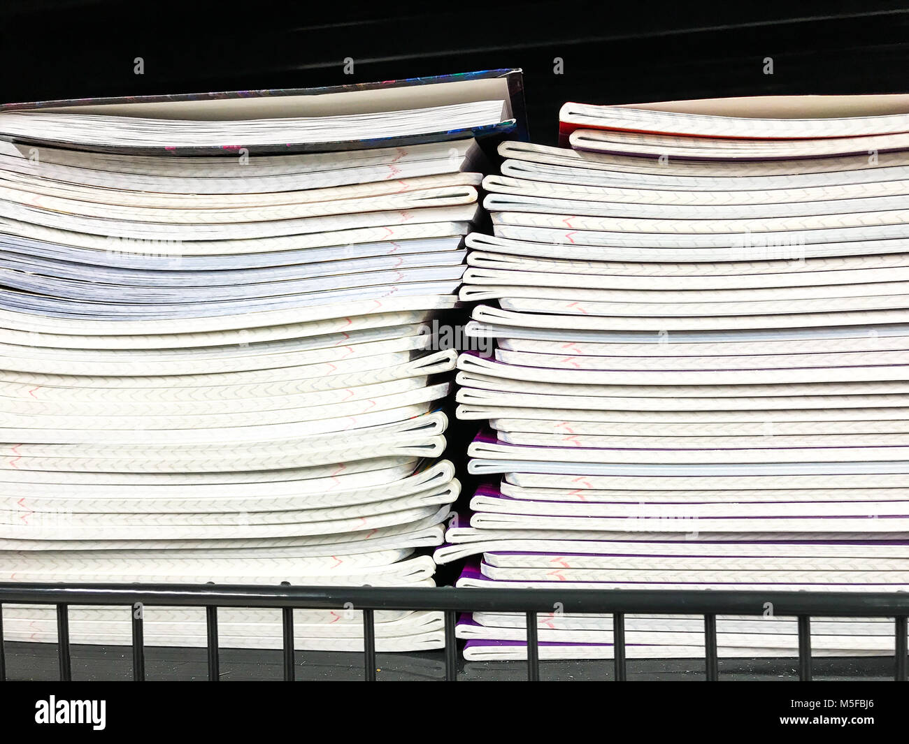 Pile of school notebooks on shelf. Studio Photo Stock Photo - Alamy