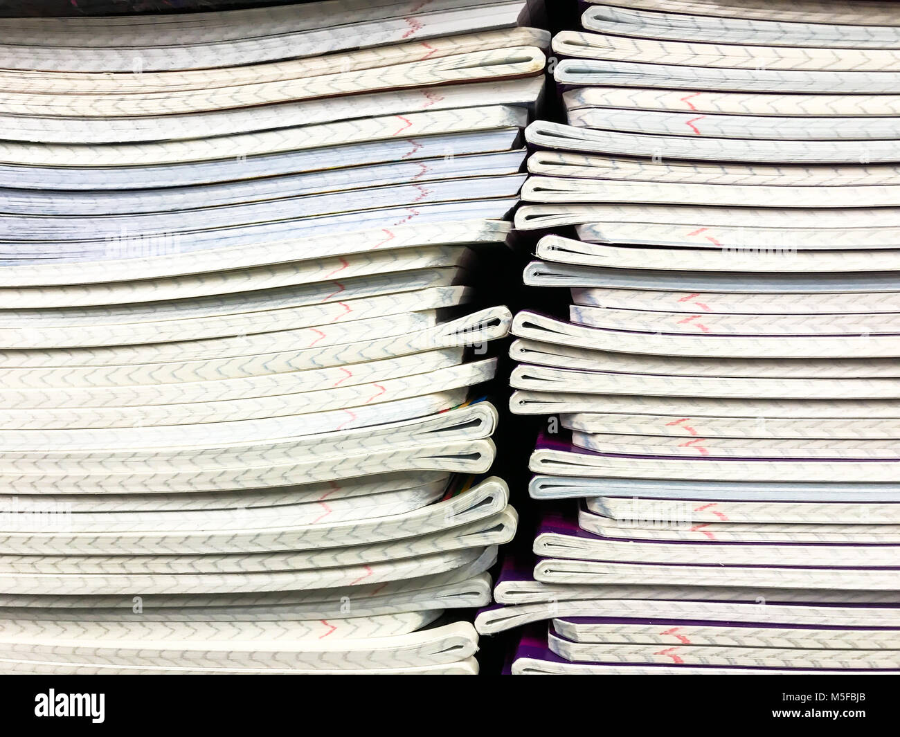 Pile of school notebooks on shelf. Studio Photo Stock Photo - Alamy