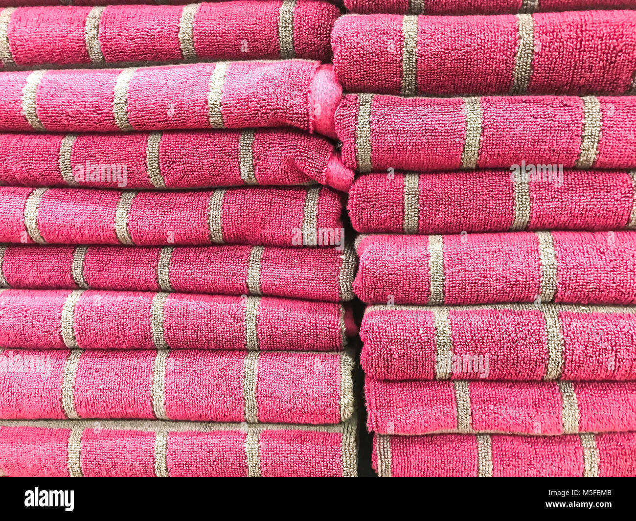 Stacks of colored terry towel on shelves. Studio Photo Stock Photo - Alamy
