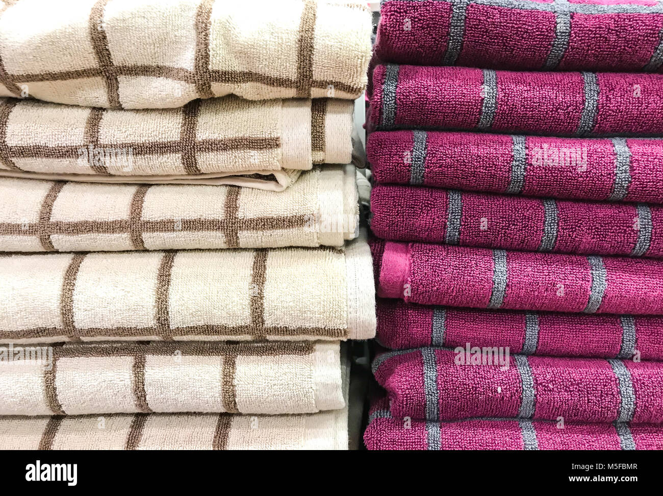 Stacks of colored terry towel on shelves. Studio Photo Stock Photo - Alamy