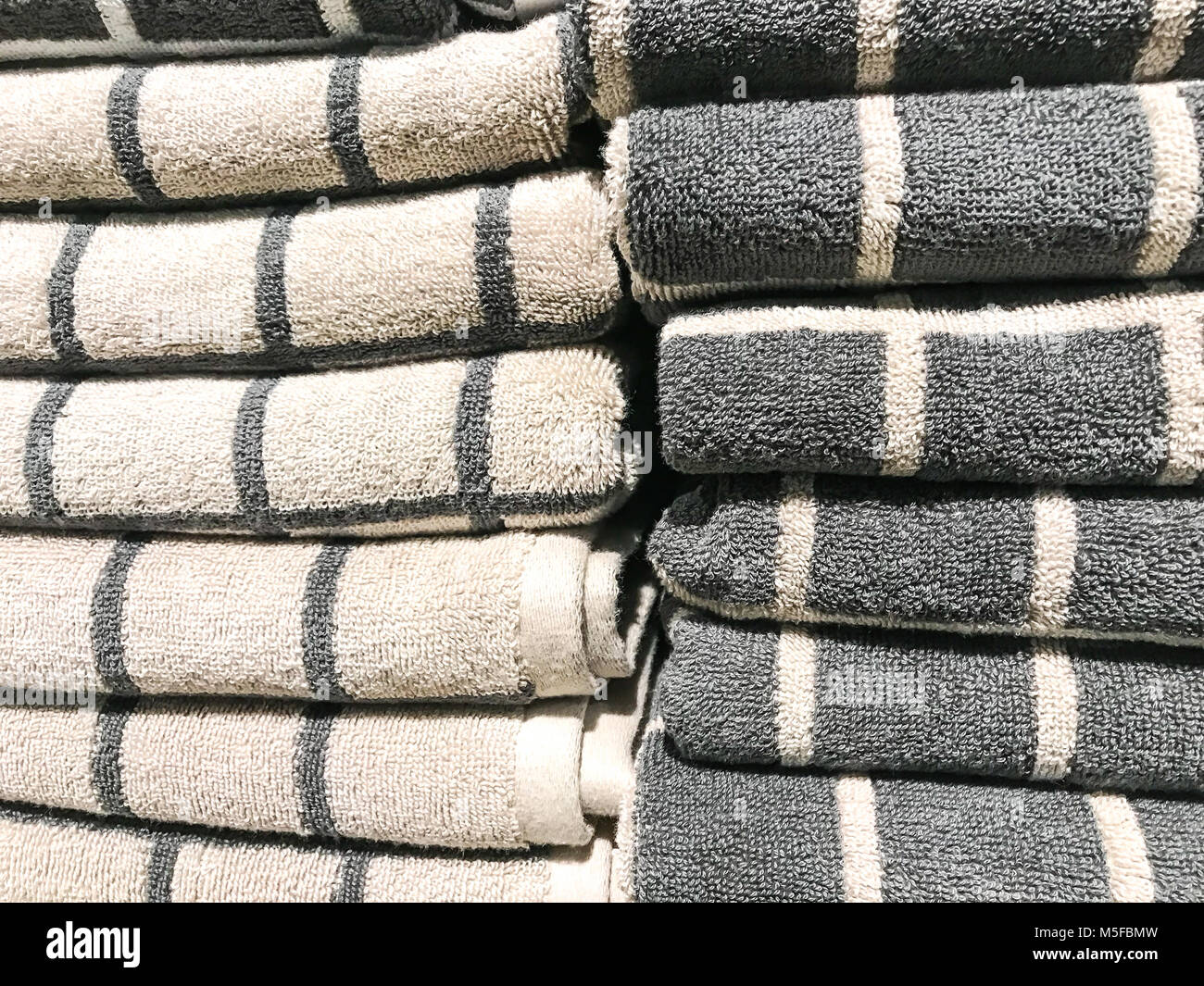 Stacks of colored terry towel on shelves. Studio Photo Stock Photo - Alamy