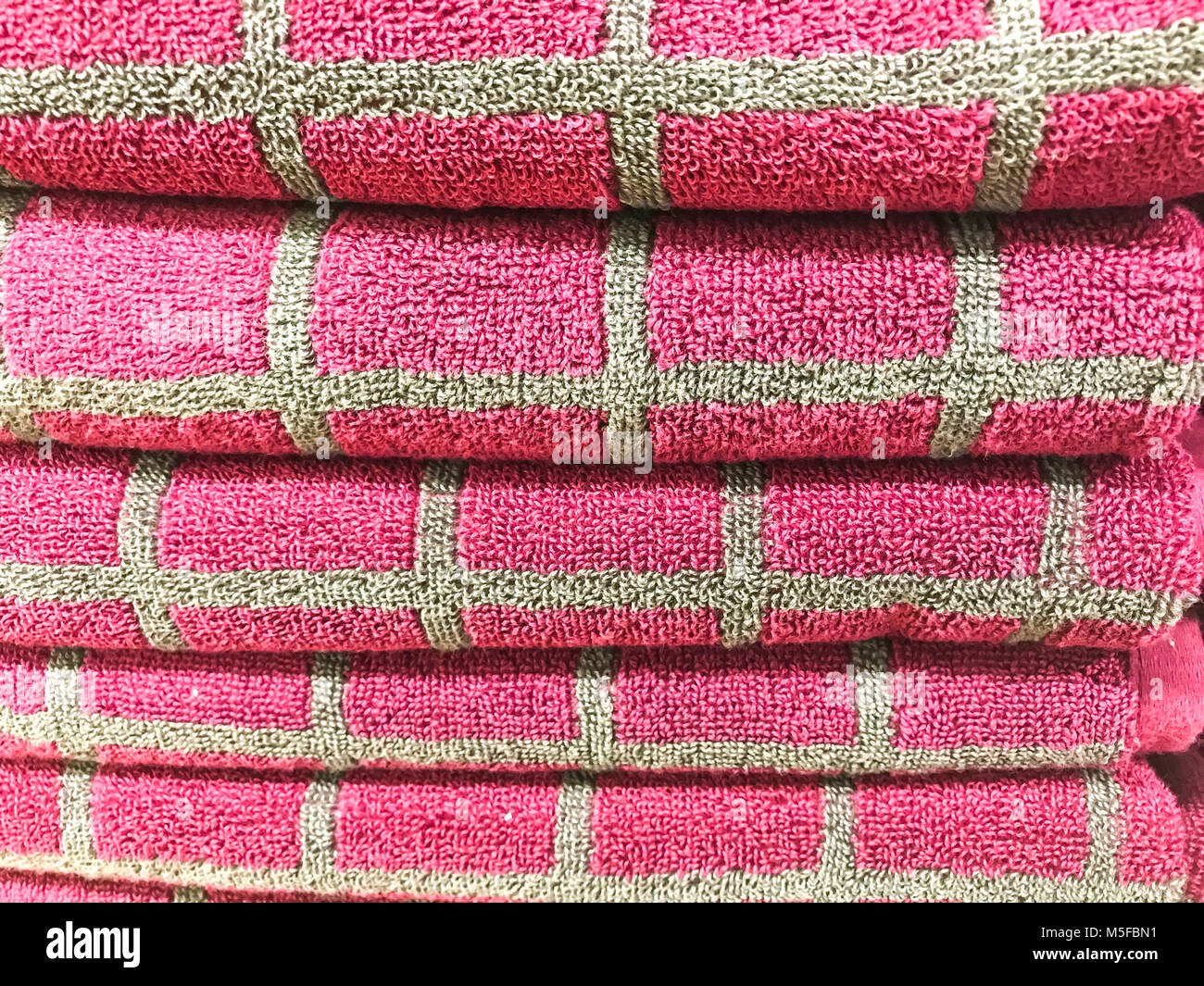 Stacks of colored terry towel on shelves. Studio Photo Stock Photo - Alamy