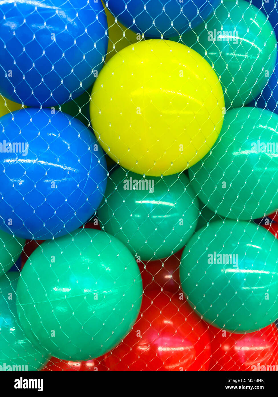 Colored balls in grid. Studio Photo Stock Photo - Alamy