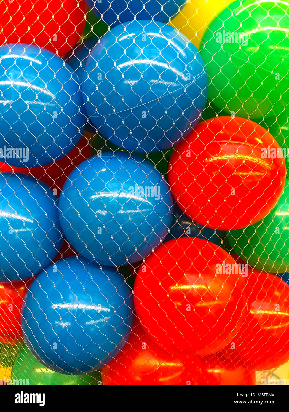 Colored balls in grid. Studio Photo Stock Photo - Alamy