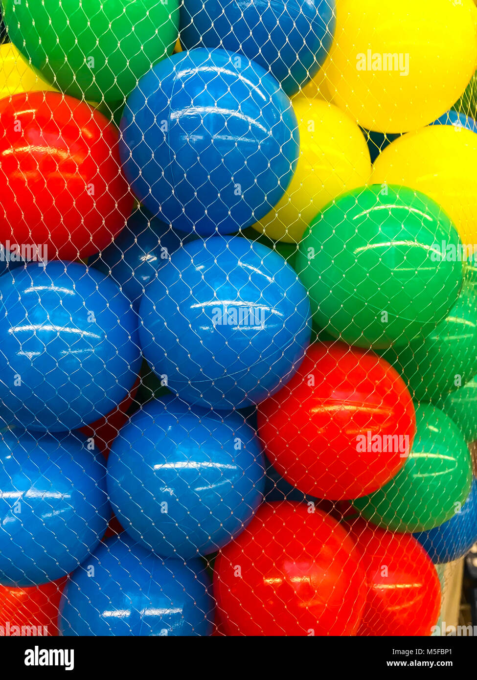Colored balls in grid. Studio Photo Stock Photo - Alamy