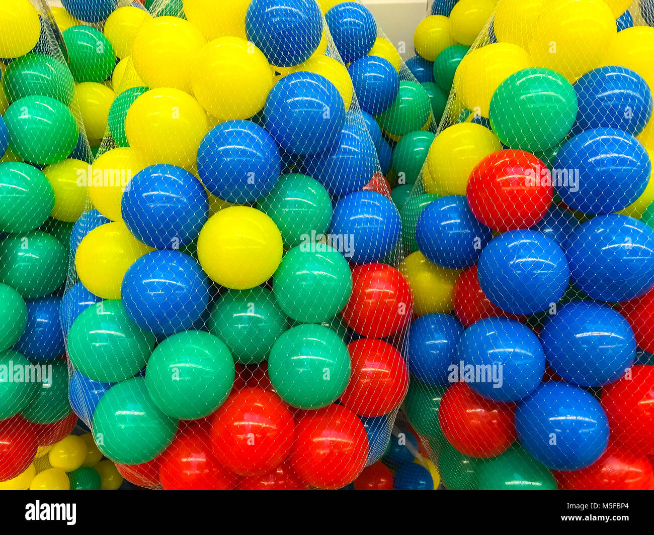 Colored balls in grid. Studio Photo Stock Photo - Alamy