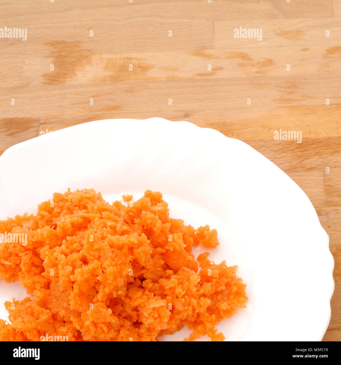 dish with minced carrot, square from above Stock Photo - Alamy