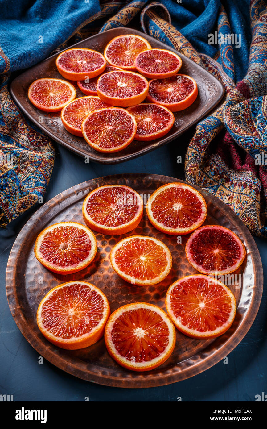 Sliced ripe juicy Sicilian blood orange fruits Stock Photo - Alamy