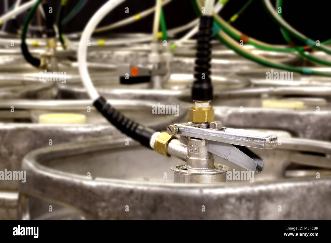 Beer barrels with the focus on the coupler/connector Stock Photo - Alamy