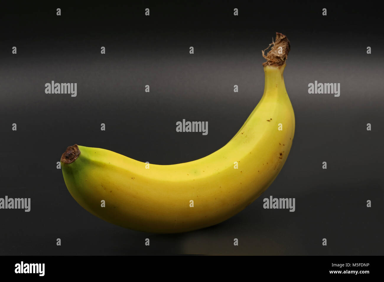 single banana close-up isolated on black background Stock Photo - Alamy
