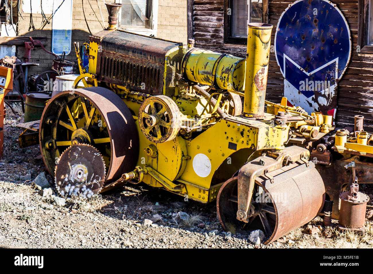 Vintage Rusty Yellow Mini Steam Roller In Salvage Yard Stock Photo - Alamy