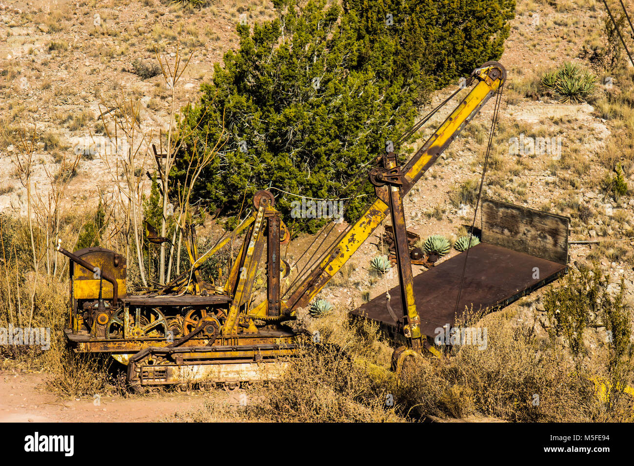 Vintage Yellow Rusty Crane Abandoned In Salvage Yard Stock Photo - Alamy