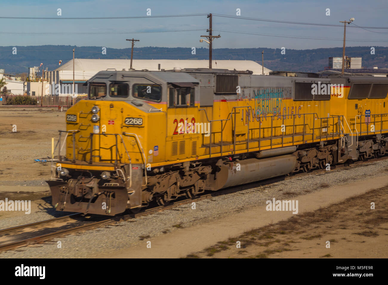 California, USA - January 10, 2015: Yellow locomotive freight train in ...