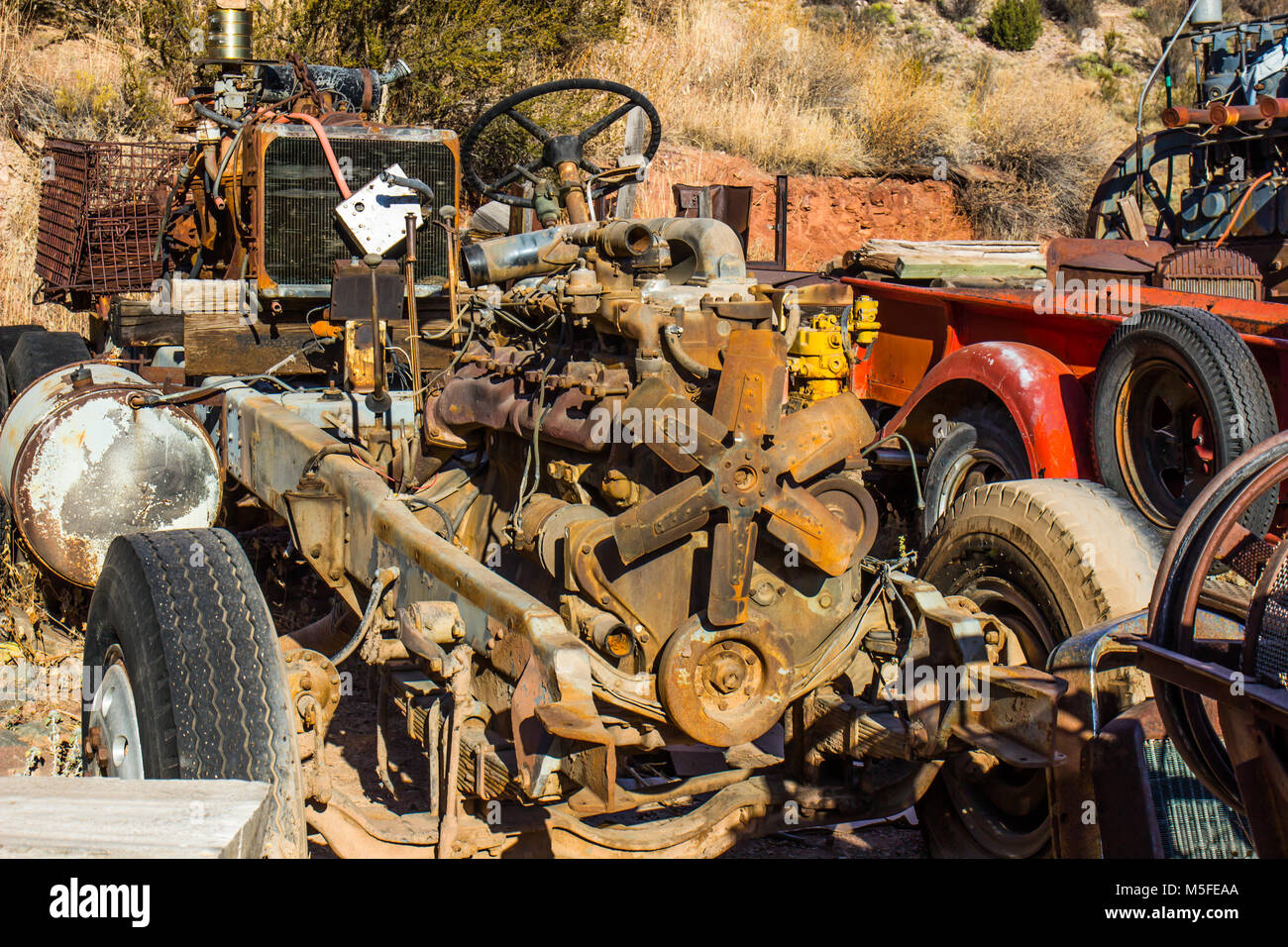 Vintage Rusty Engine On Automobile Stripped Of Parts Stock Photo - Alamy