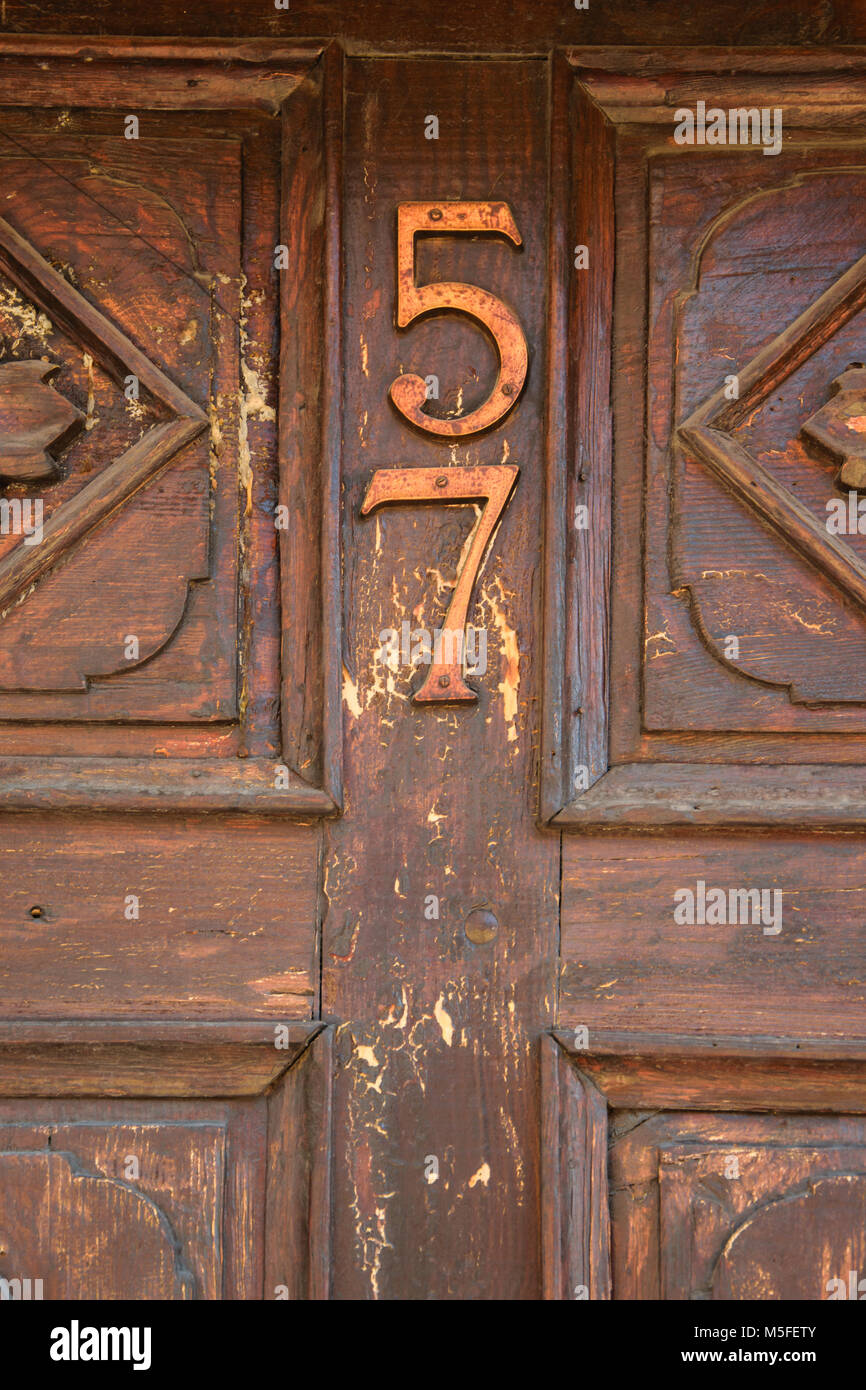 Close Up of antique wooden door number 57 Stock Photo - Alamy