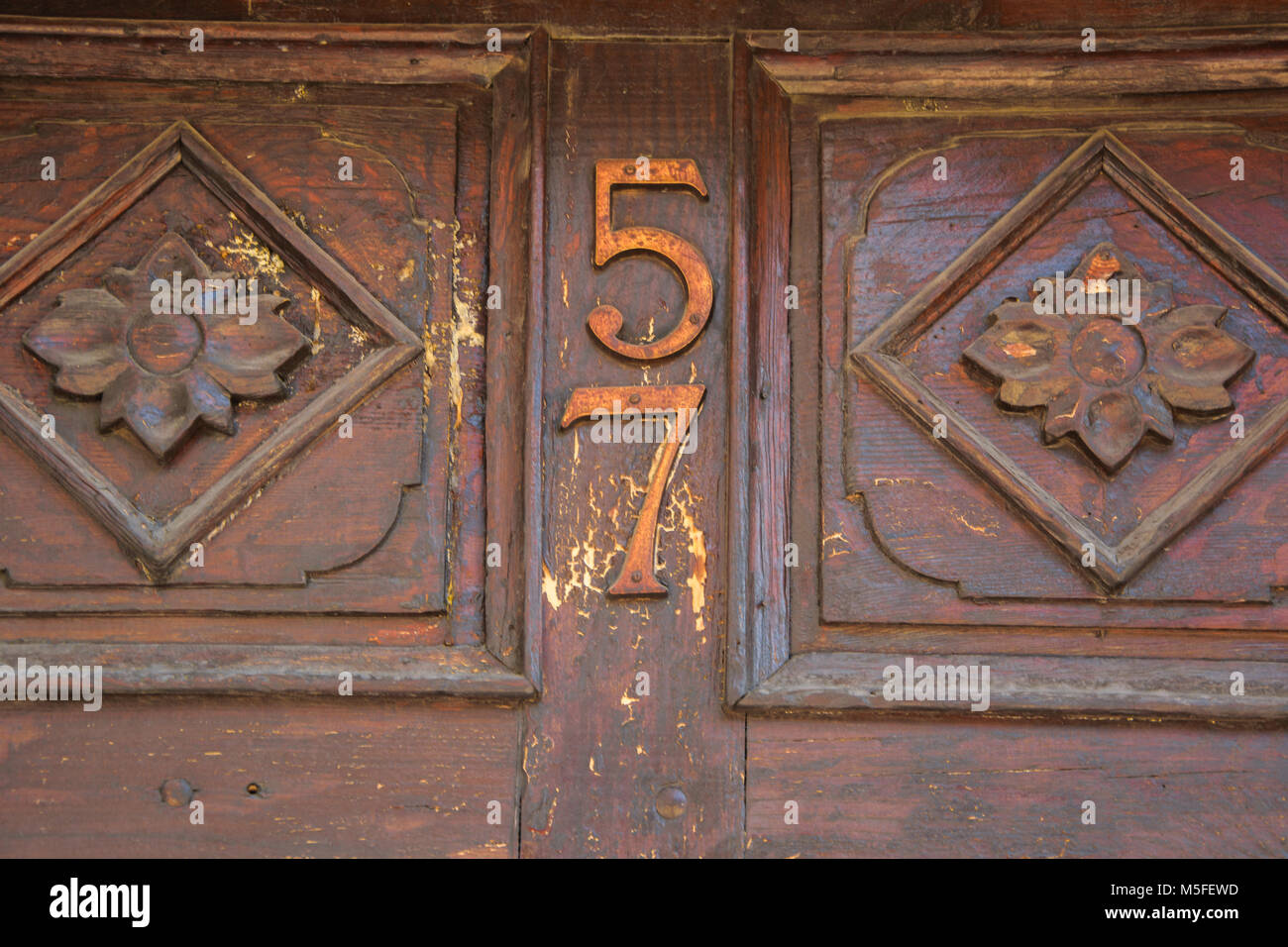 Close Up of antique wooden door number 57 Stock Photo - Alamy