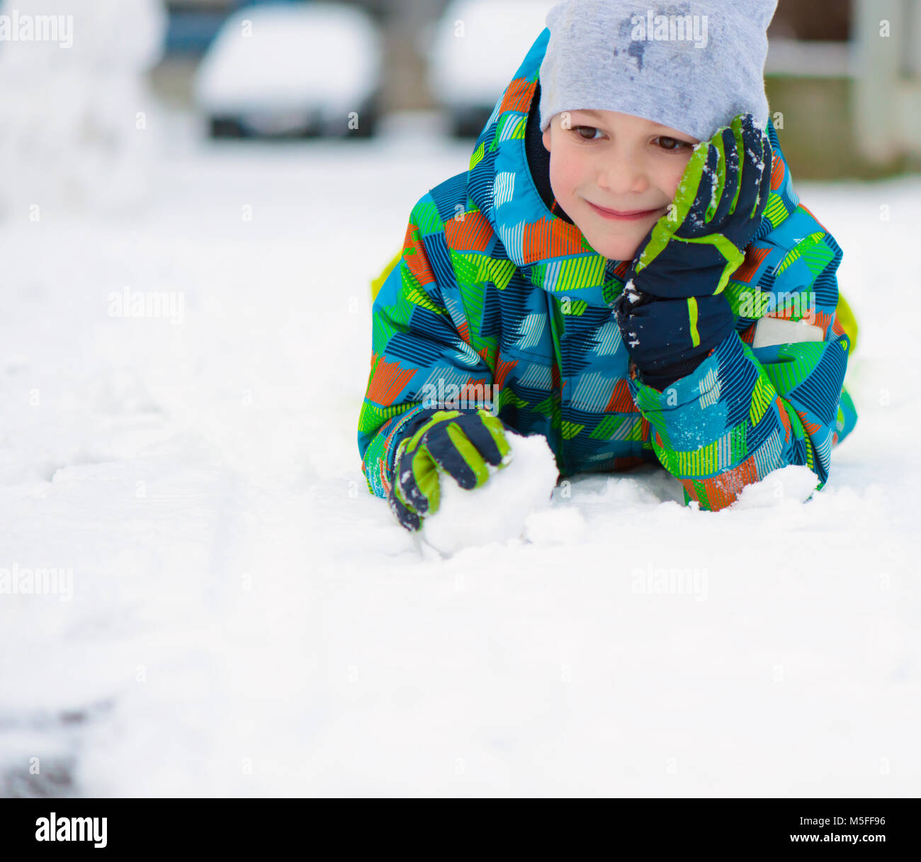 Children throwing snowballs in snowy winter park Stock Photo - Alamy