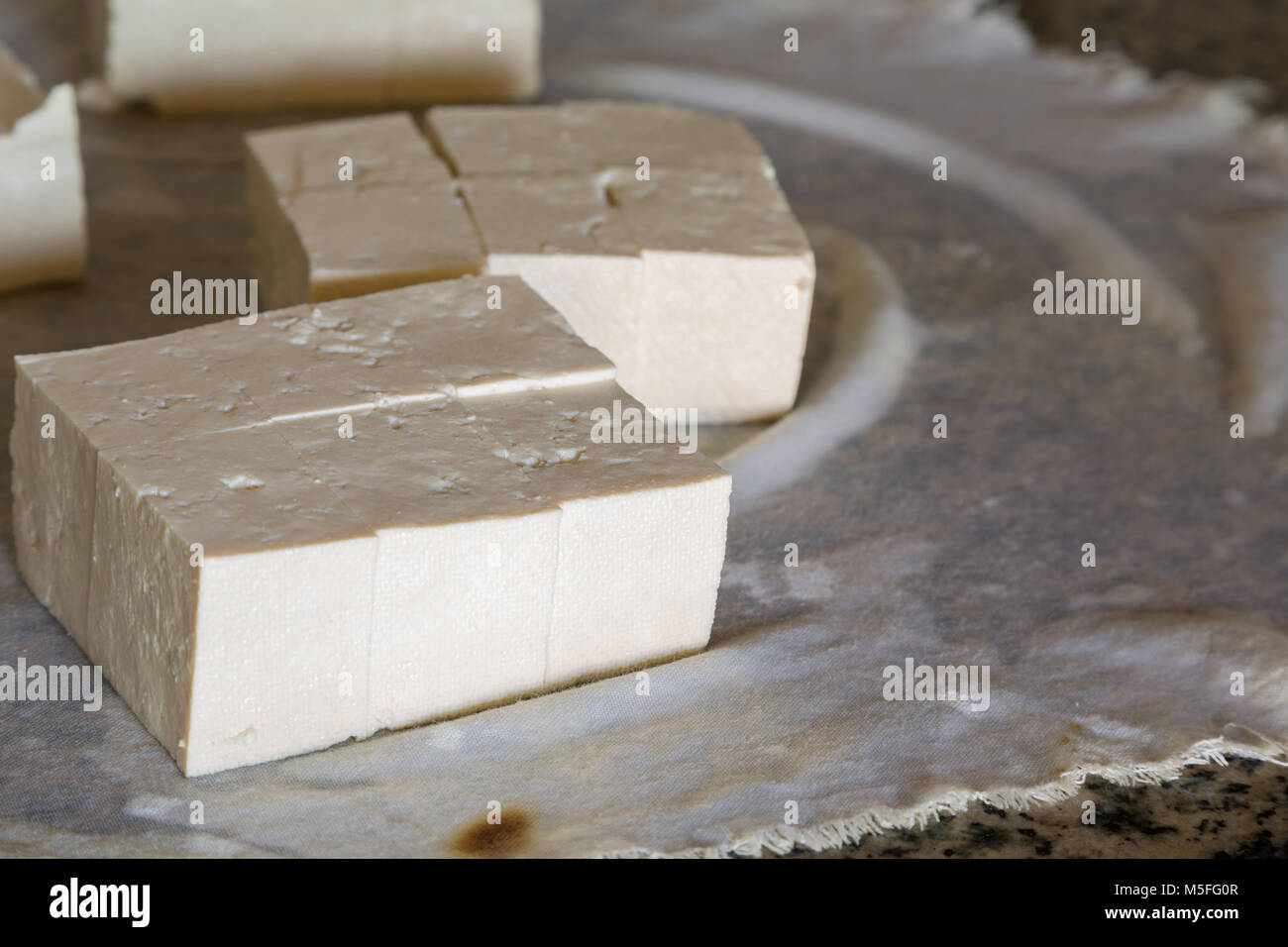 Blocks of soft tofu cubes on white dish cloth Stock Photo - Alamy