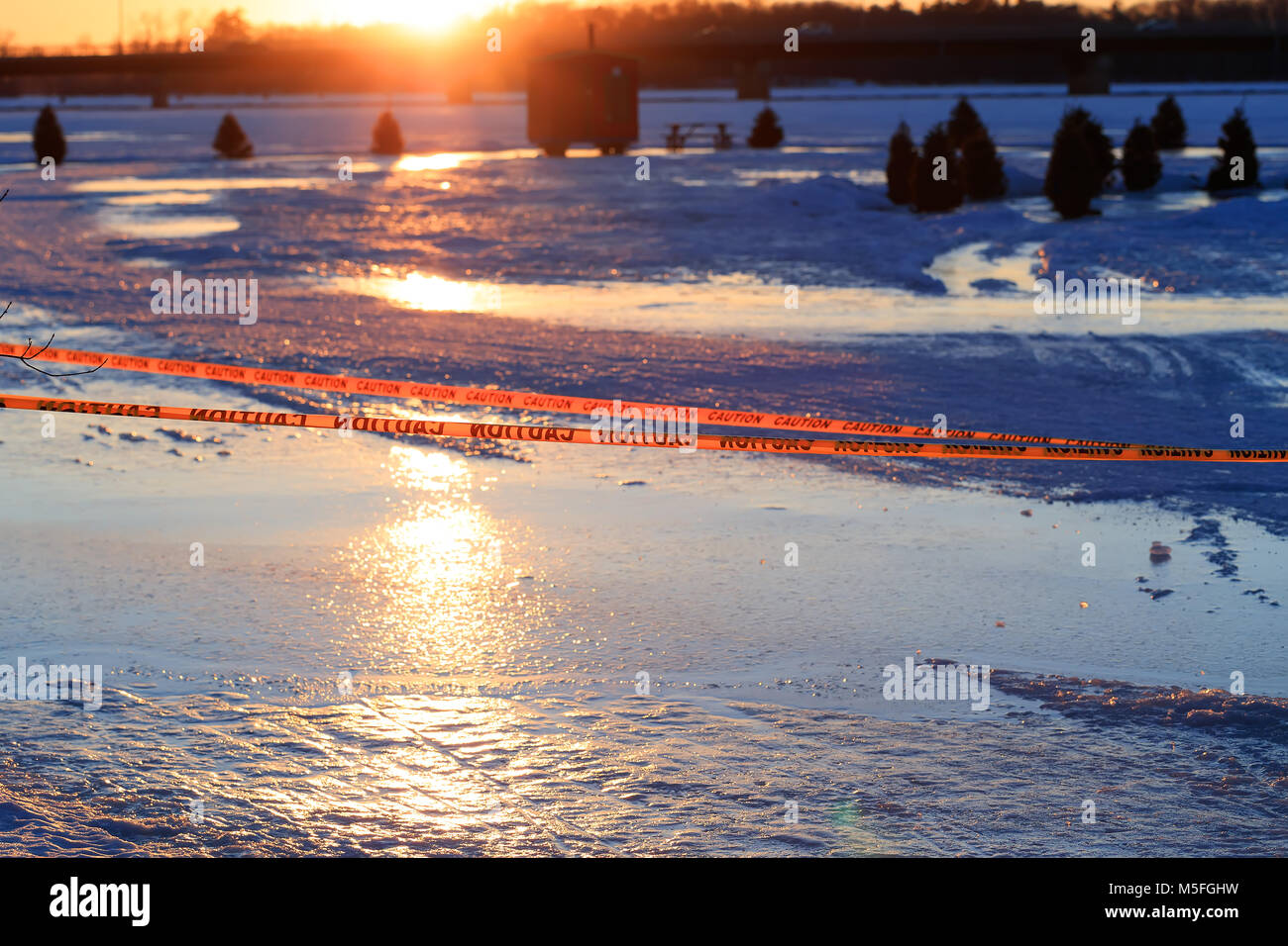 Warning sign of thin ice in the fishing village installed on the lake ...