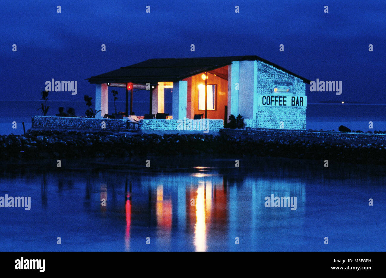 Maldives - Indian Ocean. Coffee bar by sea at night Stock Photo - Alamy