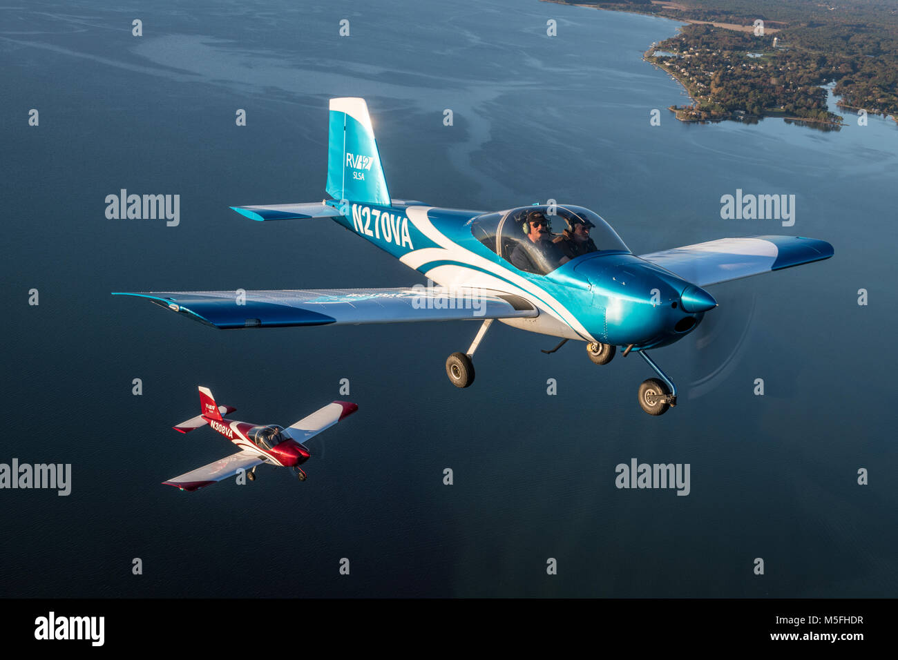 Two Vans RV-12 light sport aircrafts fly in formation together over the ...