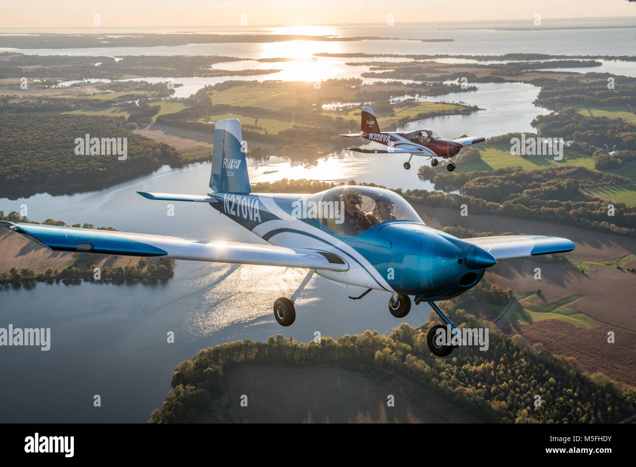 Two Vans RV-12 light sport aircrafts fly in formation together over the ...