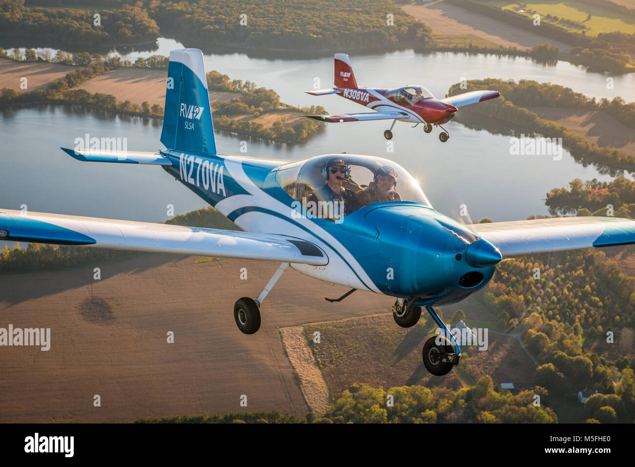 Two Vans RV-12 light sport aircrafts fly in formation together over the ...
