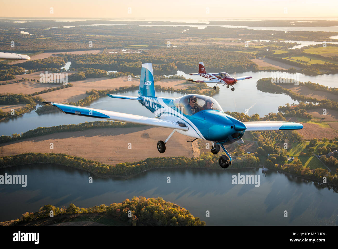 Two Vans RV-12 light sport aircrafts fly in formation together over the ...