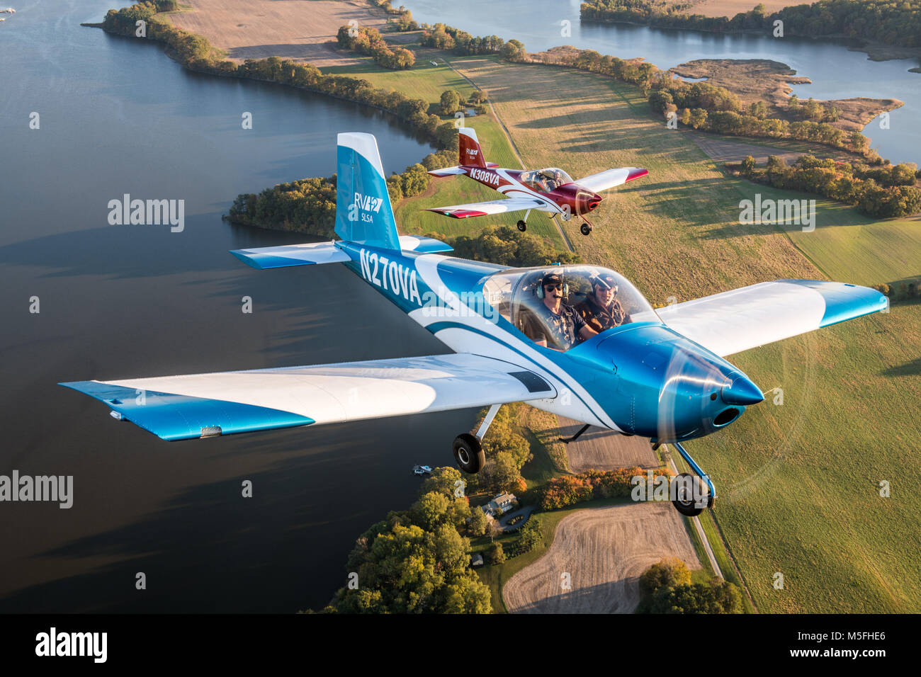 Two Vans RV-12 light sport aircrafts fly in formation together over the ...