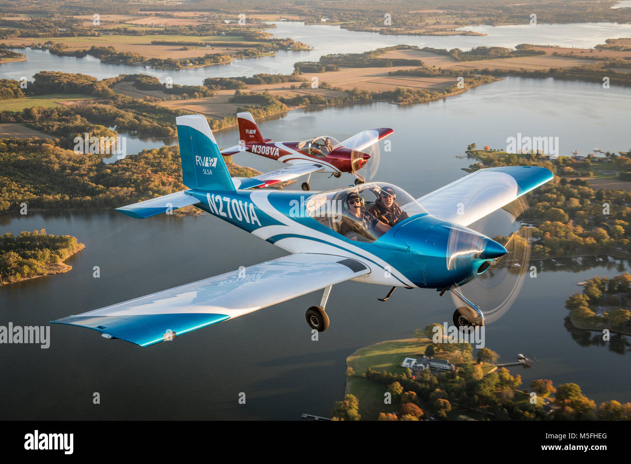 Two Vans RV-12 light sport aircrafts fly in formation together over the ...