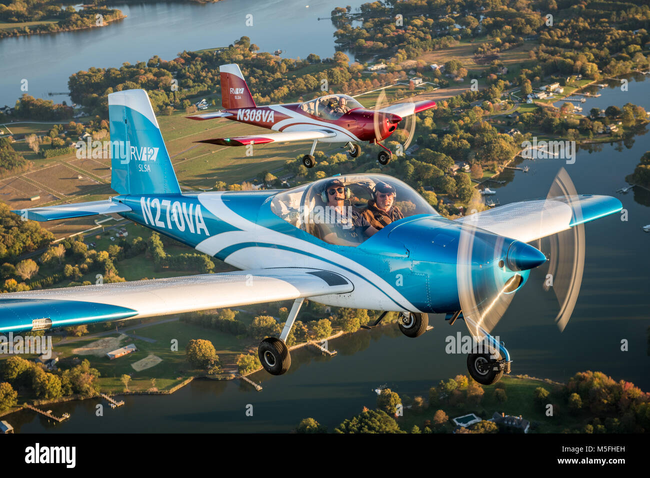 Two Vans RV-12 light sport aircrafts fly in formation together over the ...