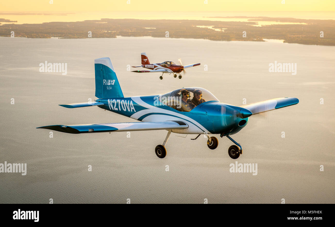 Two Vans RV-12 light sport aircrafts fly in formation together over the ...