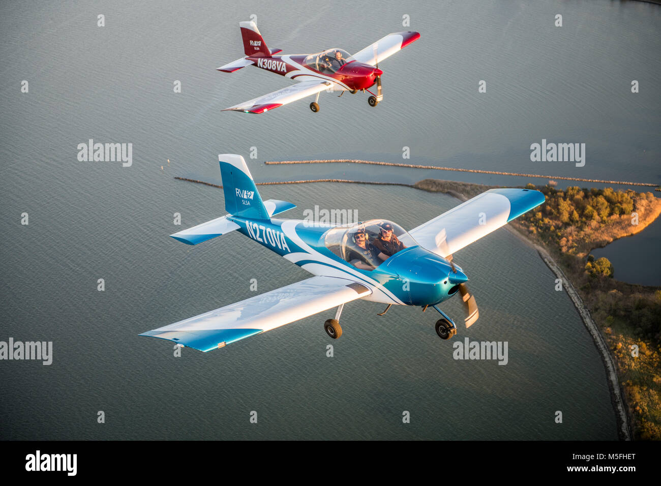 Two Vans RV-12 light sport aircrafts fly in formation together over the ...