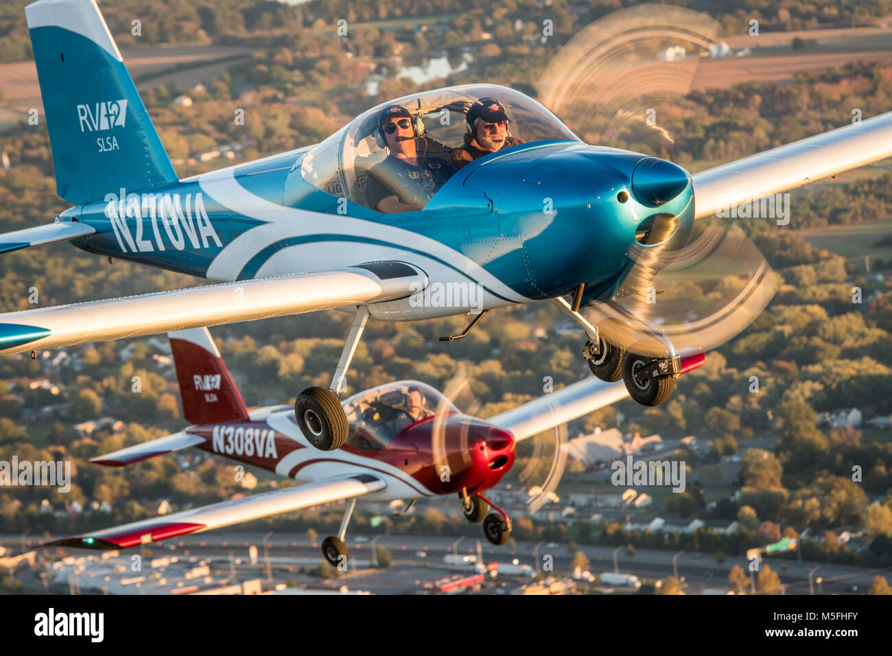 Two Vans RV-12 light sport aircrafts fly in formation together over the ...