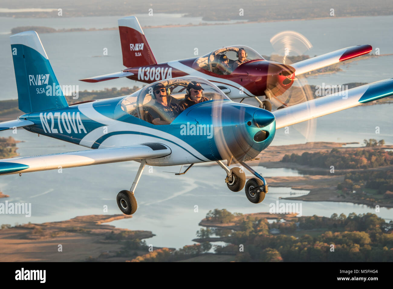 Two Vans RV-12 light sport aircrafts fly in formation together over the ...