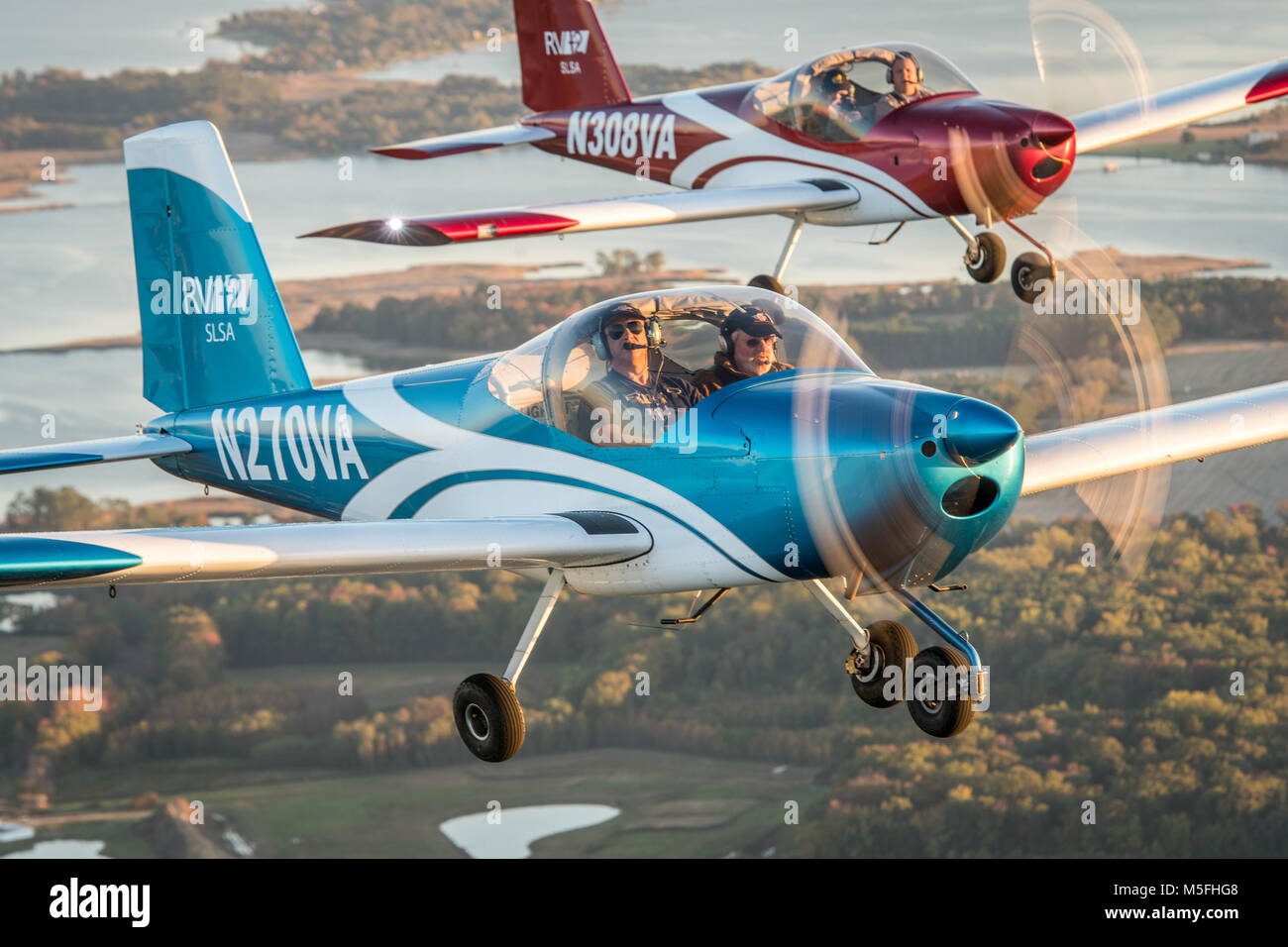 Two Vans RV-12 light sport aircrafts fly in formation together over the ...