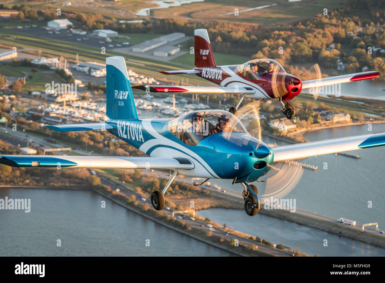 Two Vans RV-12 light sport aircrafts fly in formation together over the ...