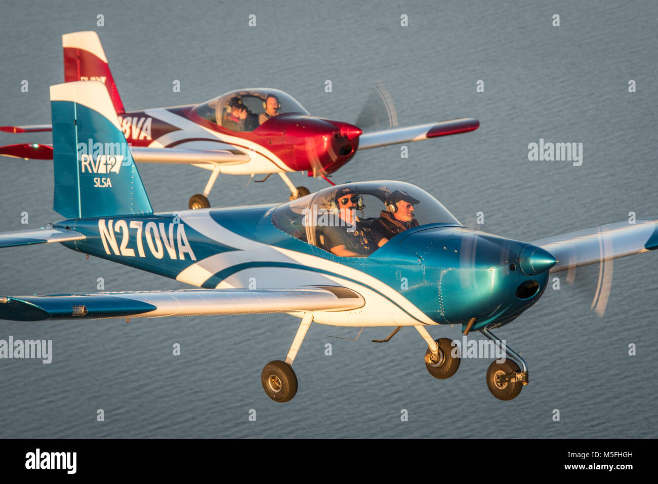 Two Vans RV-12 light sport aircrafts fly in formation together over the ...
