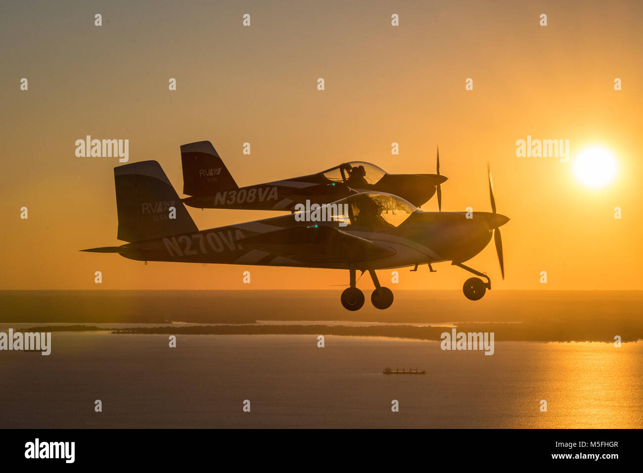 Two Vans RV-12 light sport aircrafts fly in formation together with the ...